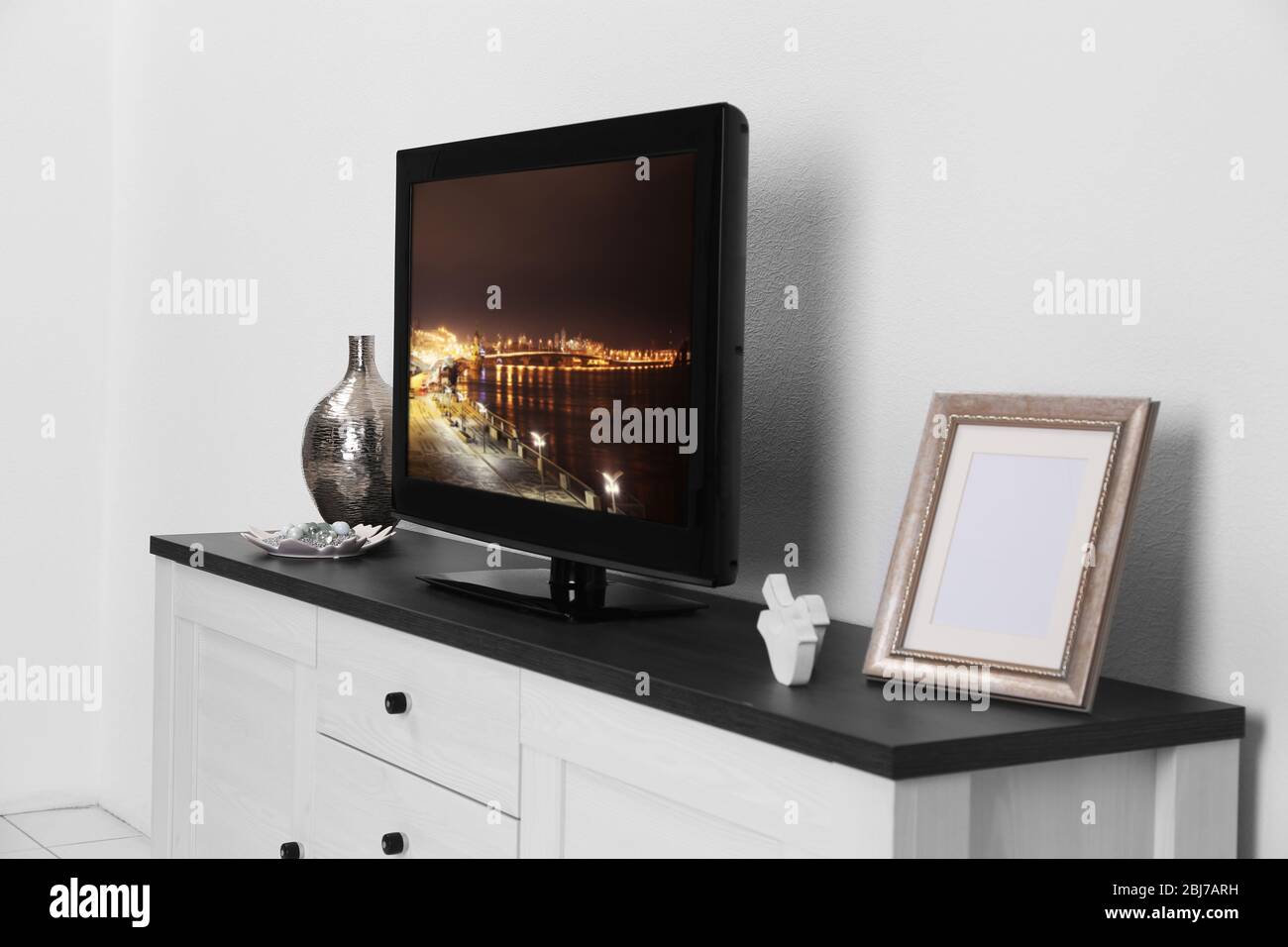 TV set in the interior of light room Stock Photo - Alamy