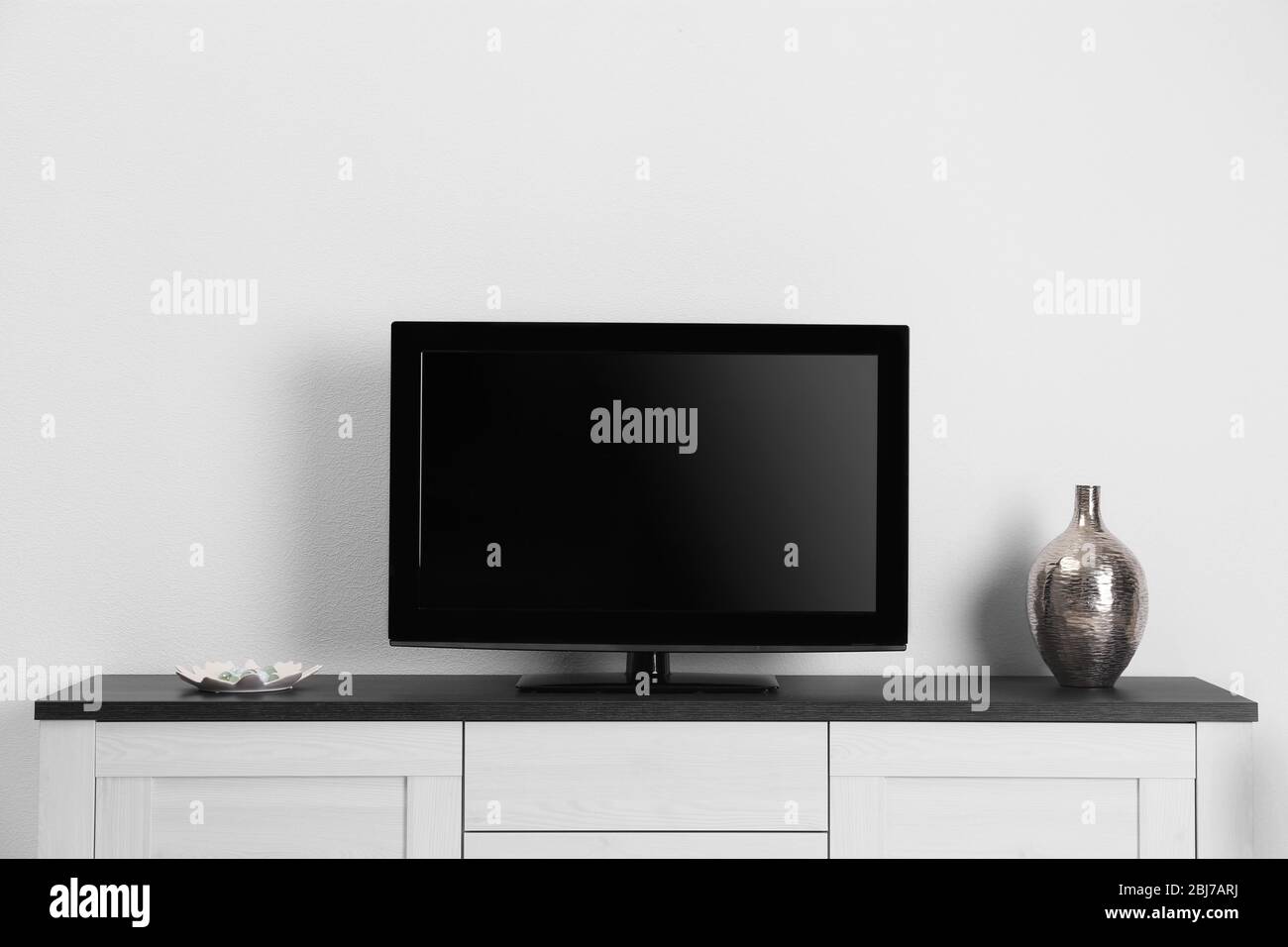 TV set in the interior of light room Stock Photo - Alamy