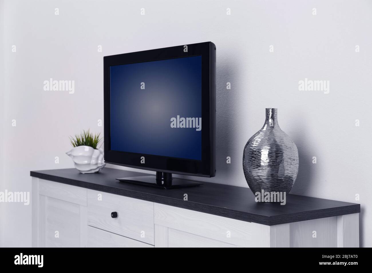 TV set in the interior of light room Stock Photo - Alamy