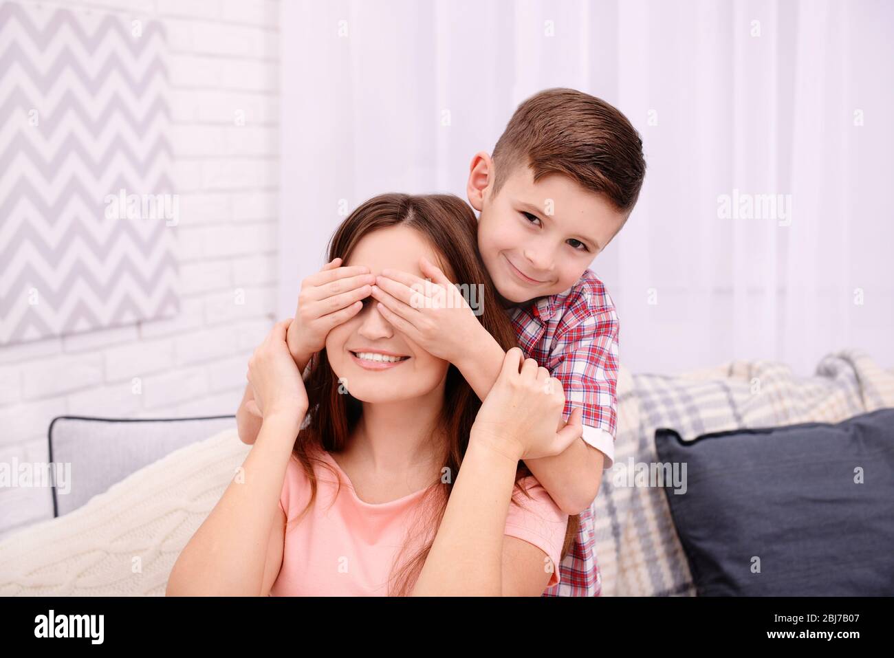 Son closing his mother eyes with his hands Stock Photo - Alamy