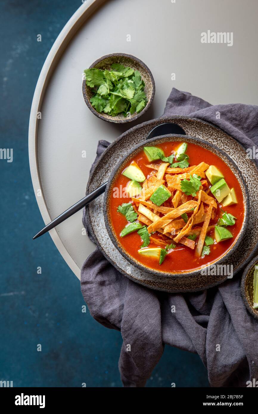 Mexican style table with spicy aztec soup with fried tortilla. Sopa ...