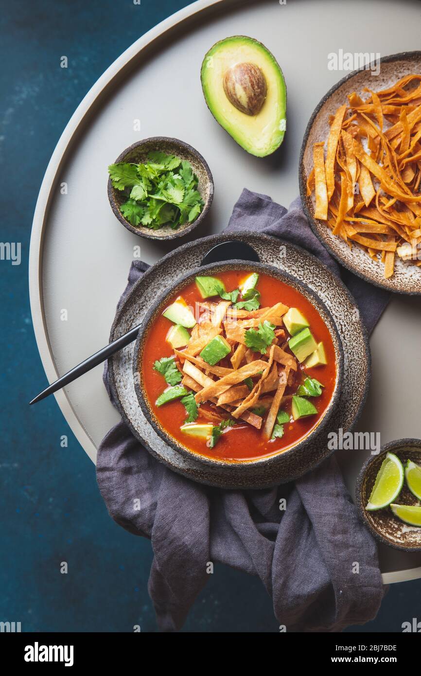Mexican style table with spicy aztec soup with fried tortilla. Sopa ...