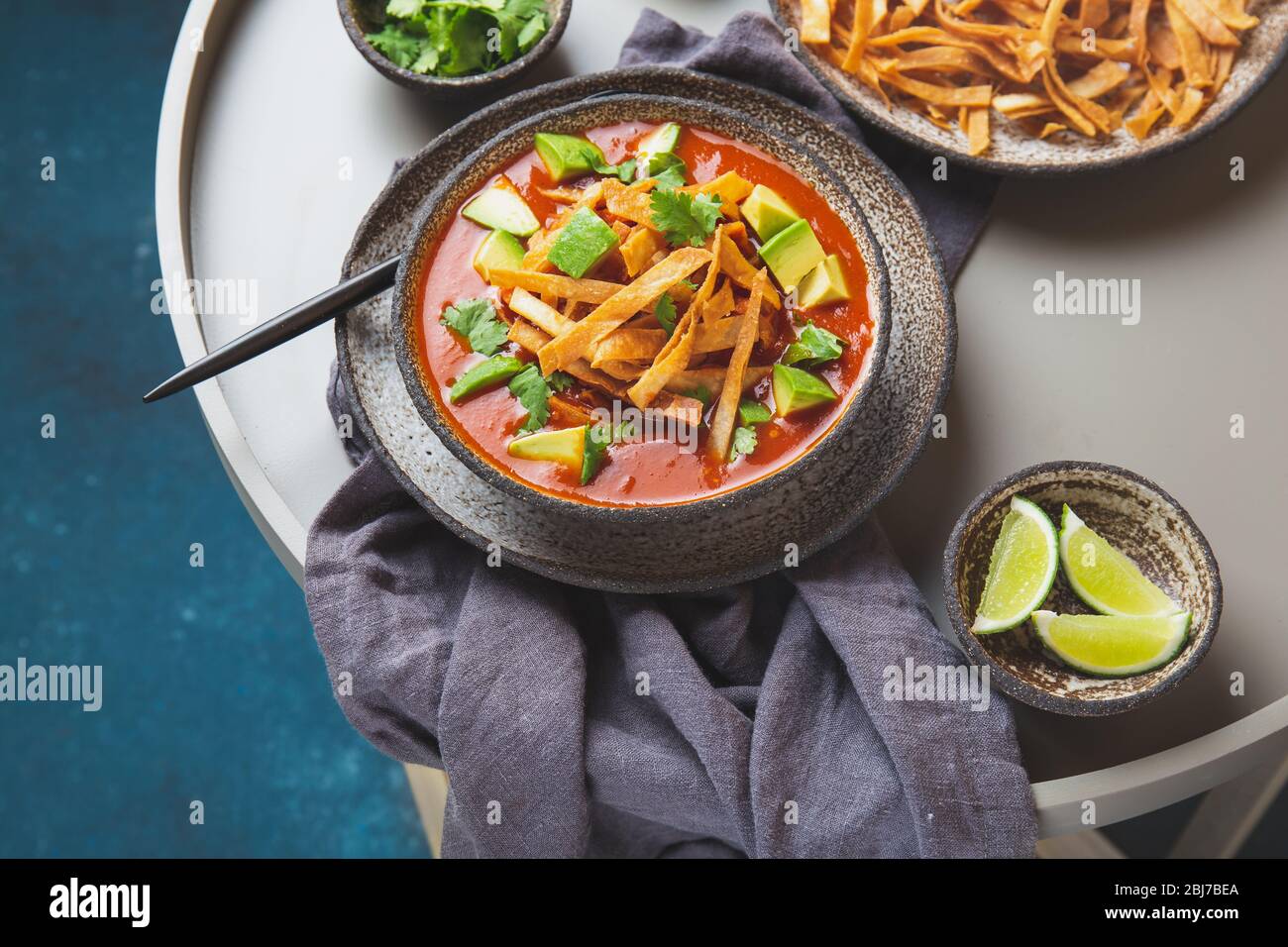 Mexican style table with spicy aztec soup with fried tortilla. Sopa ...