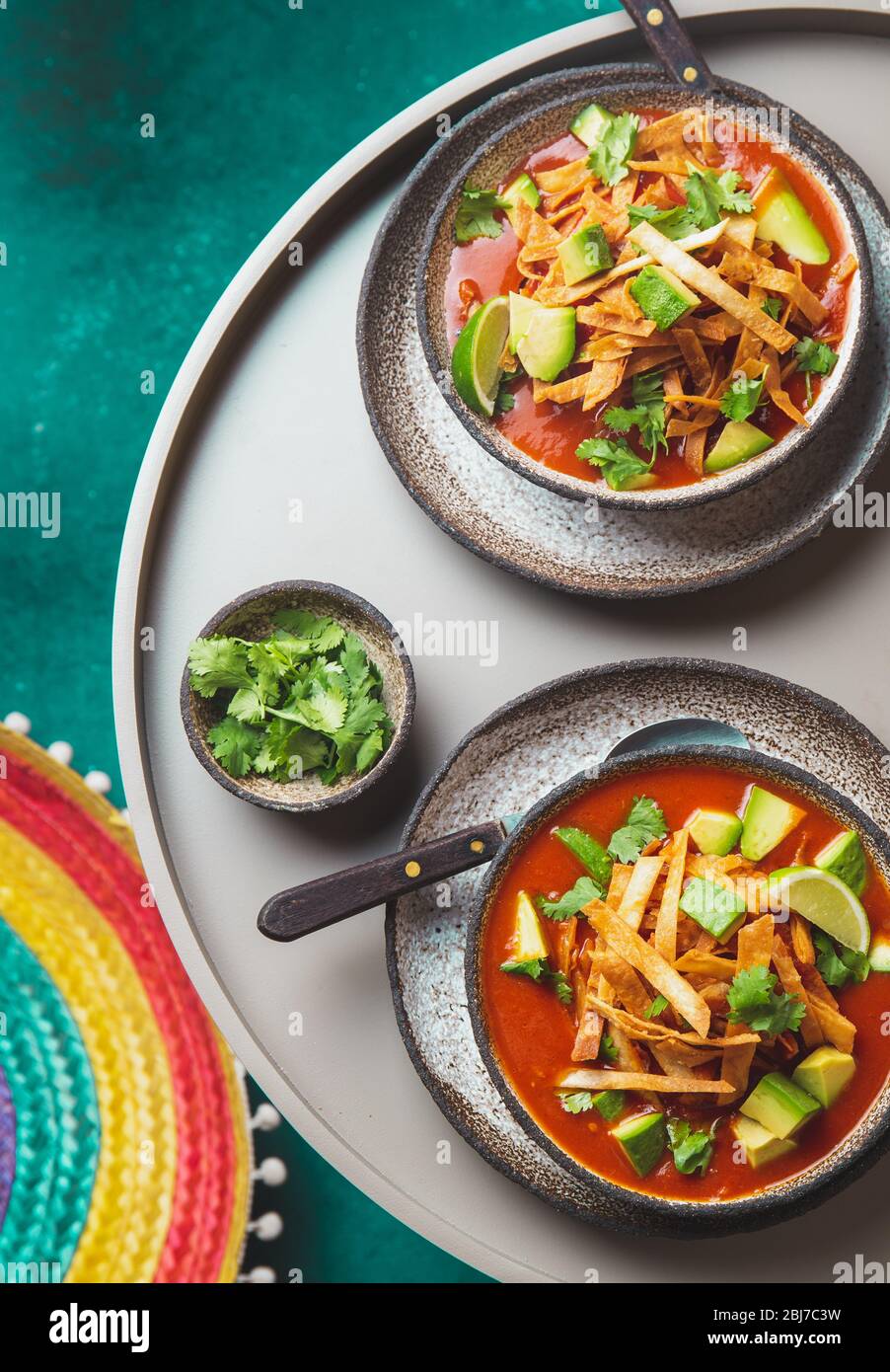 Mexican style table with spicy aztec soup with fried tortilla. Sopa ...