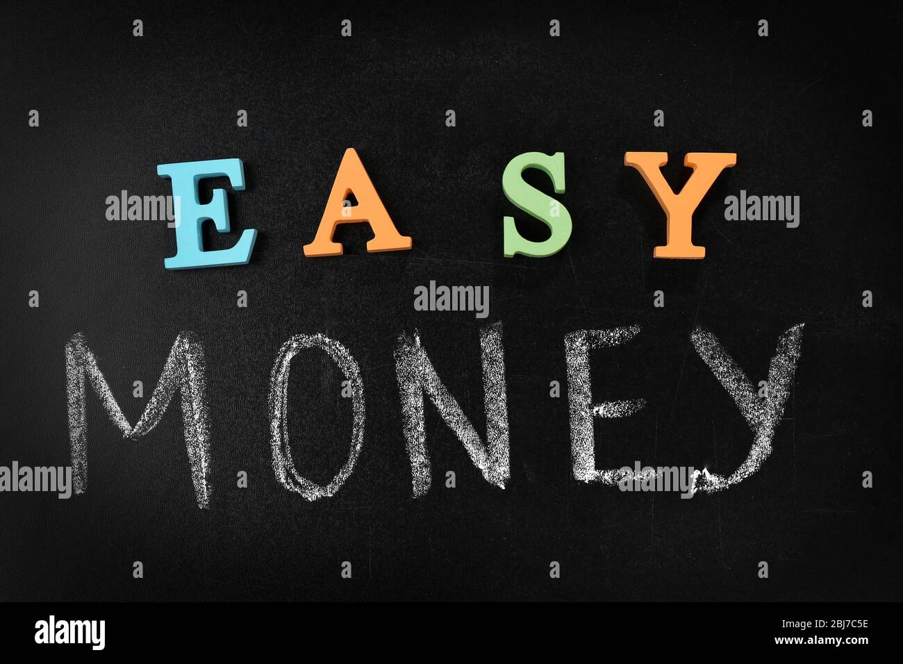 Easy money concept on a blackboard background Stock Photo - Alamy