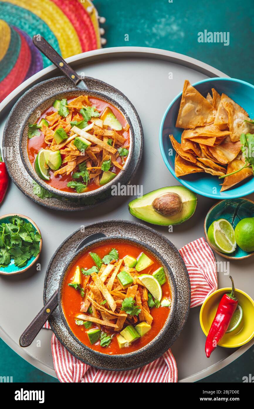 Mexican style table with spicy aztec soup with tortilla. Copy space ...