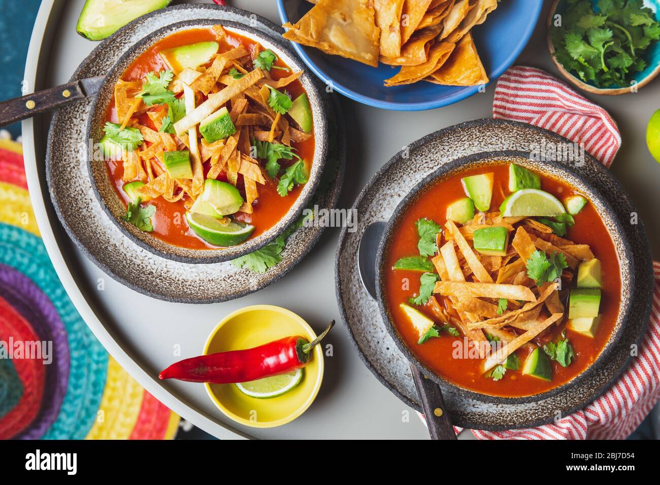 Mexican style table with spicy aztec soup with tortilla. Copy space ...