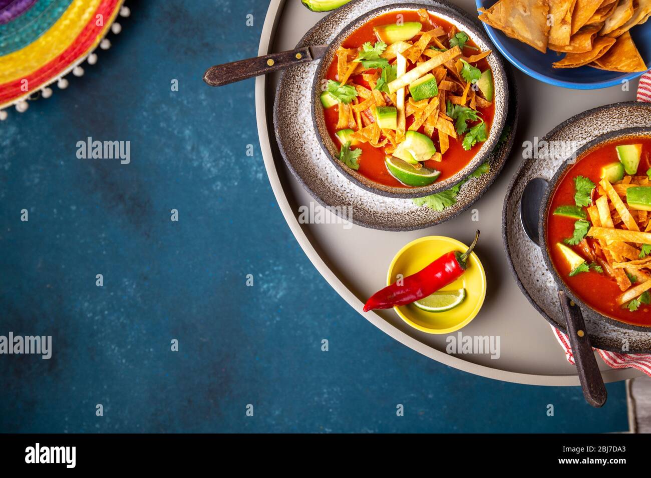 Mexican style table with spicy aztec soup with tortilla. Copy space ...