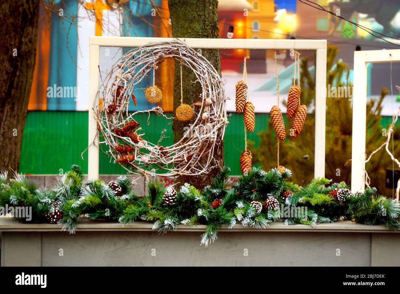 Table decorated with Christmas tree branches and wreath of twigs ...