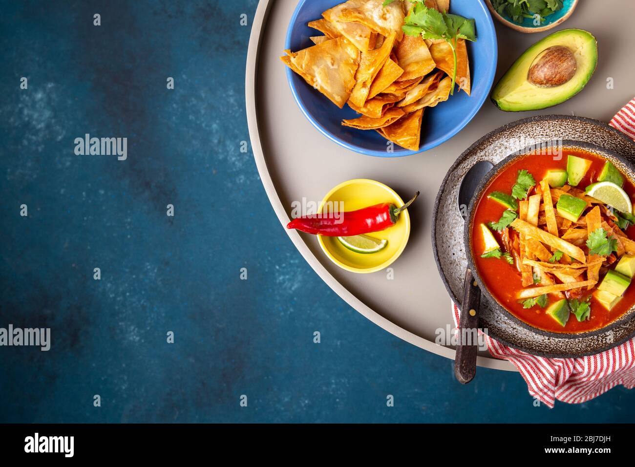 Mexican style table with spicy aztec soup with tortilla. Copy space ...