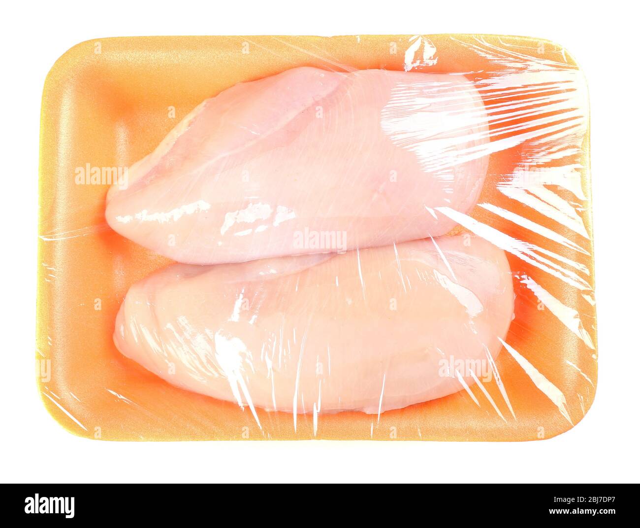 Packed pieces of chicken meat, isolated on white Stock Photo - Alamy
