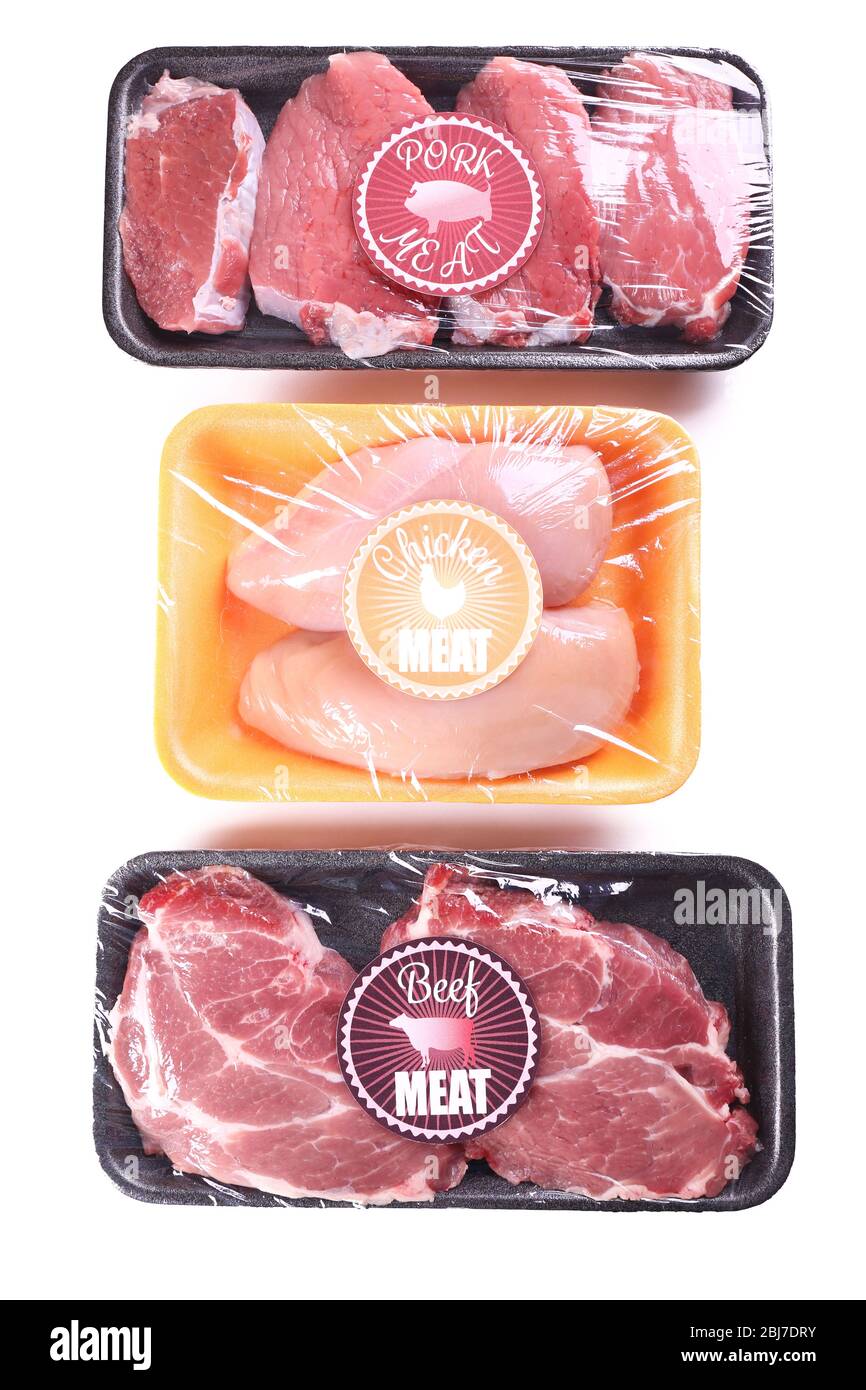 Packed pieces of chicken, pork and beef meat, isolated on white Stock ...