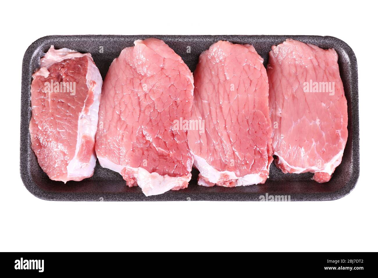 Packed pieces of beef meat, isolated on white Stock Photo - Alamy
