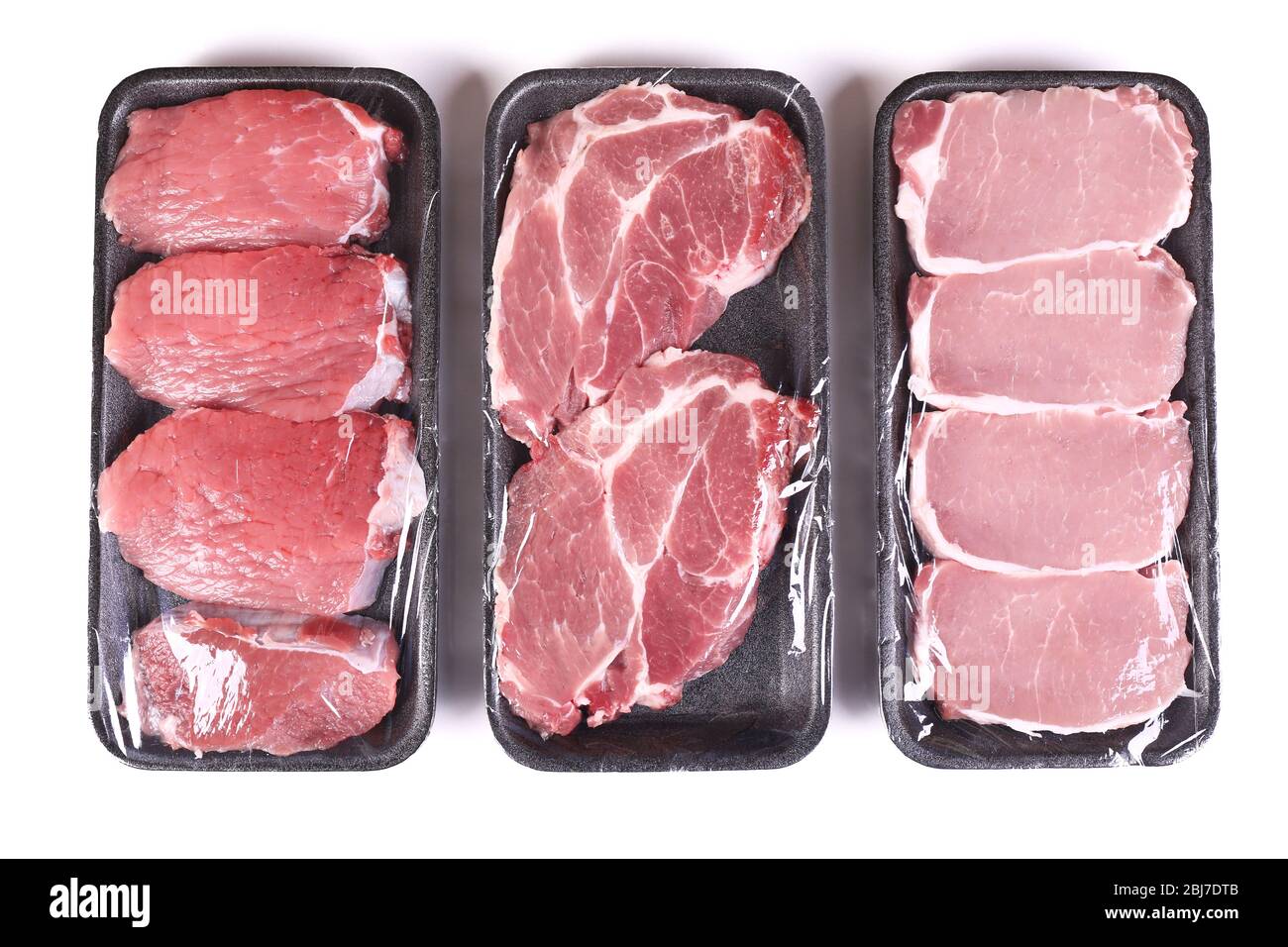 Packed pieces of pork and beef meat, isolated on white Stock Photo - Alamy
