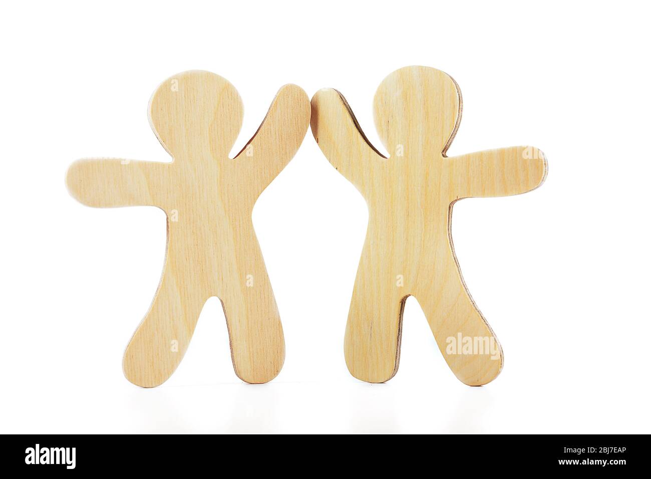 Couple of wooden figures, isolated on white Stock Photo - Alamy