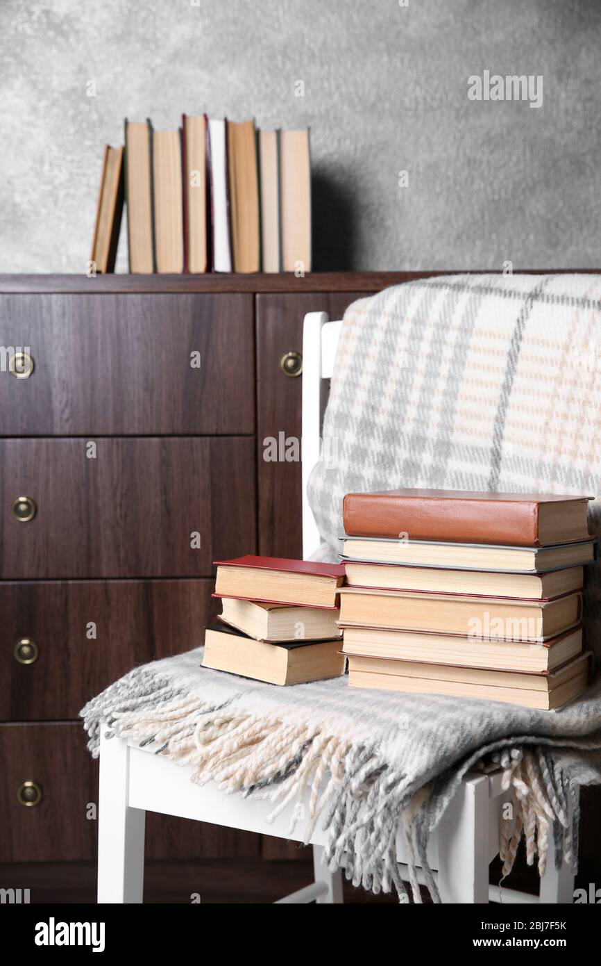 Books plaid on chair hi-res stock photography and images - Alamy
