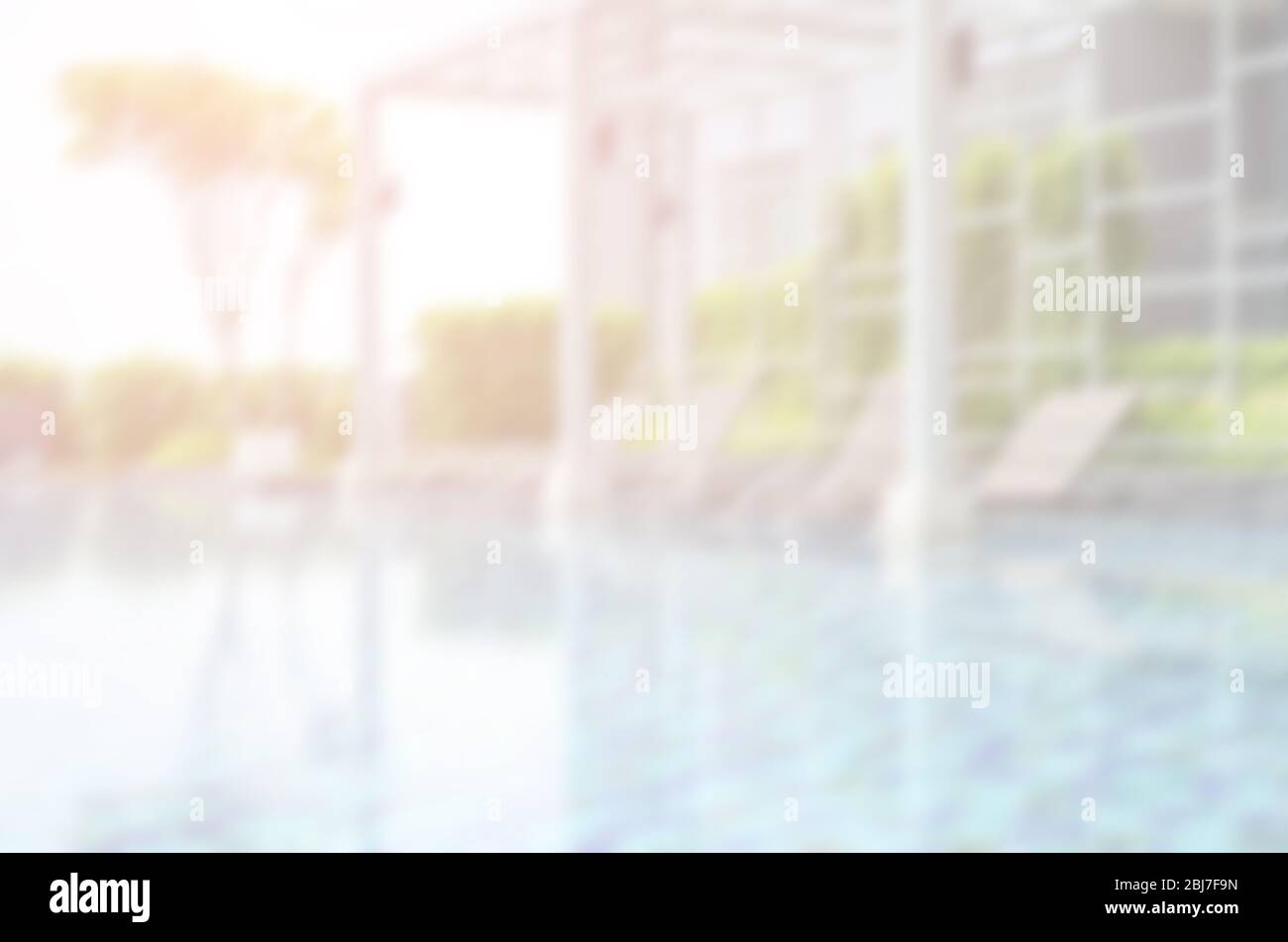 Blur white swimming pool garden background with warm light Stock Photo ...