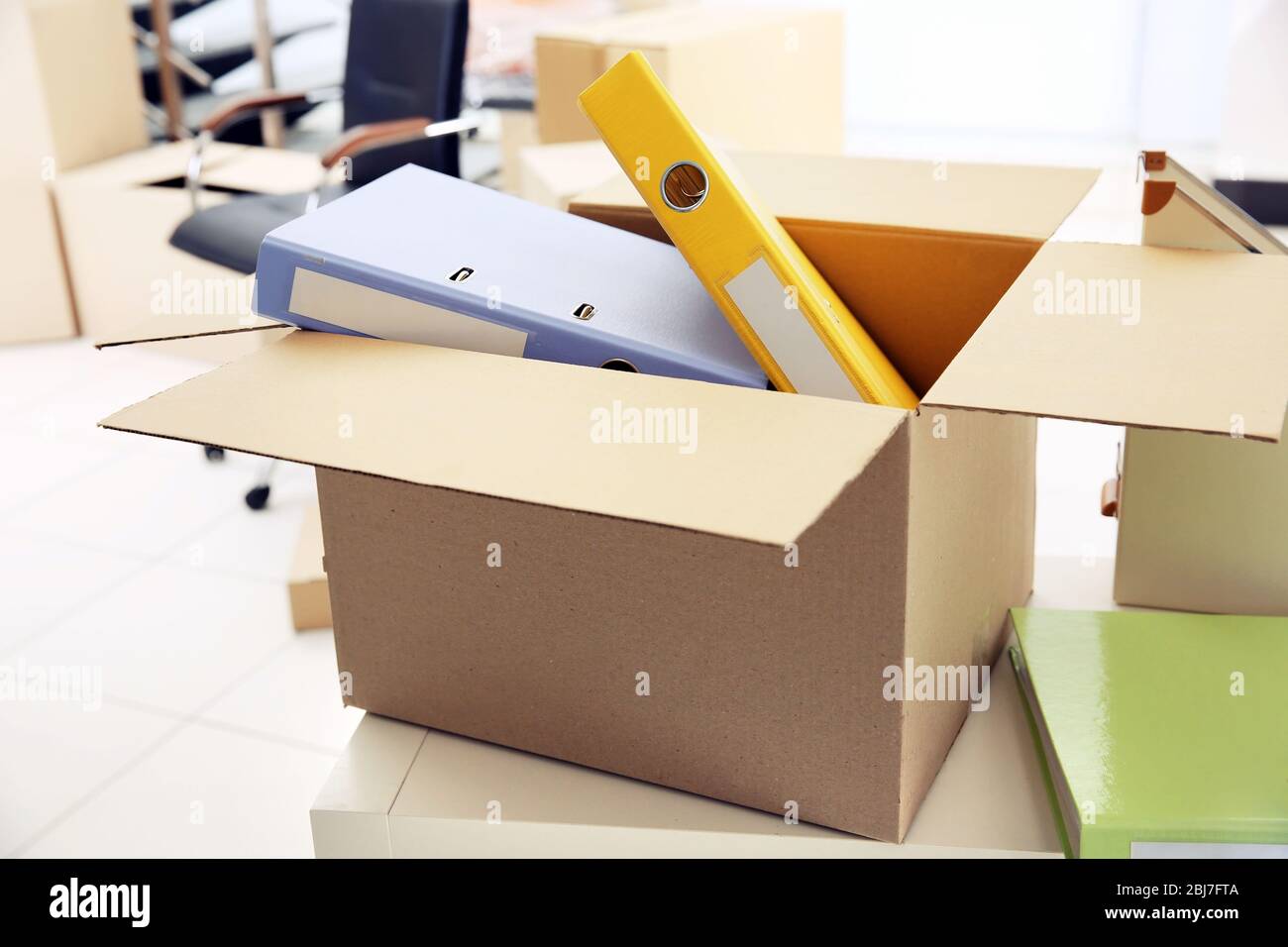 Move concept. Unpacking cardboard boxes in a new office Stock Photo - Alamy