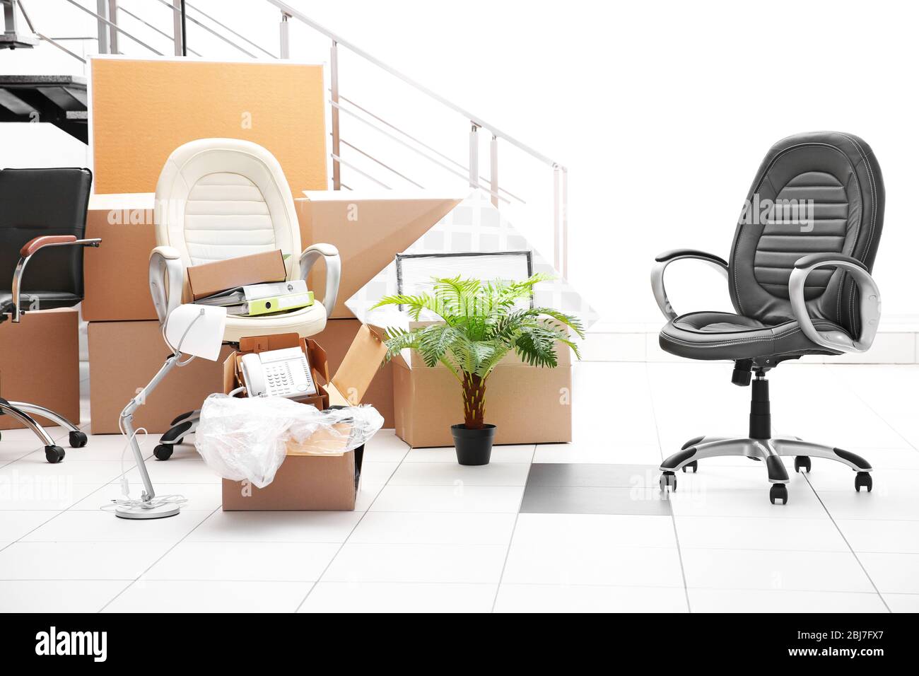 Move concept. Unpacking cardboard boxes in a new office Stock Photo - Alamy