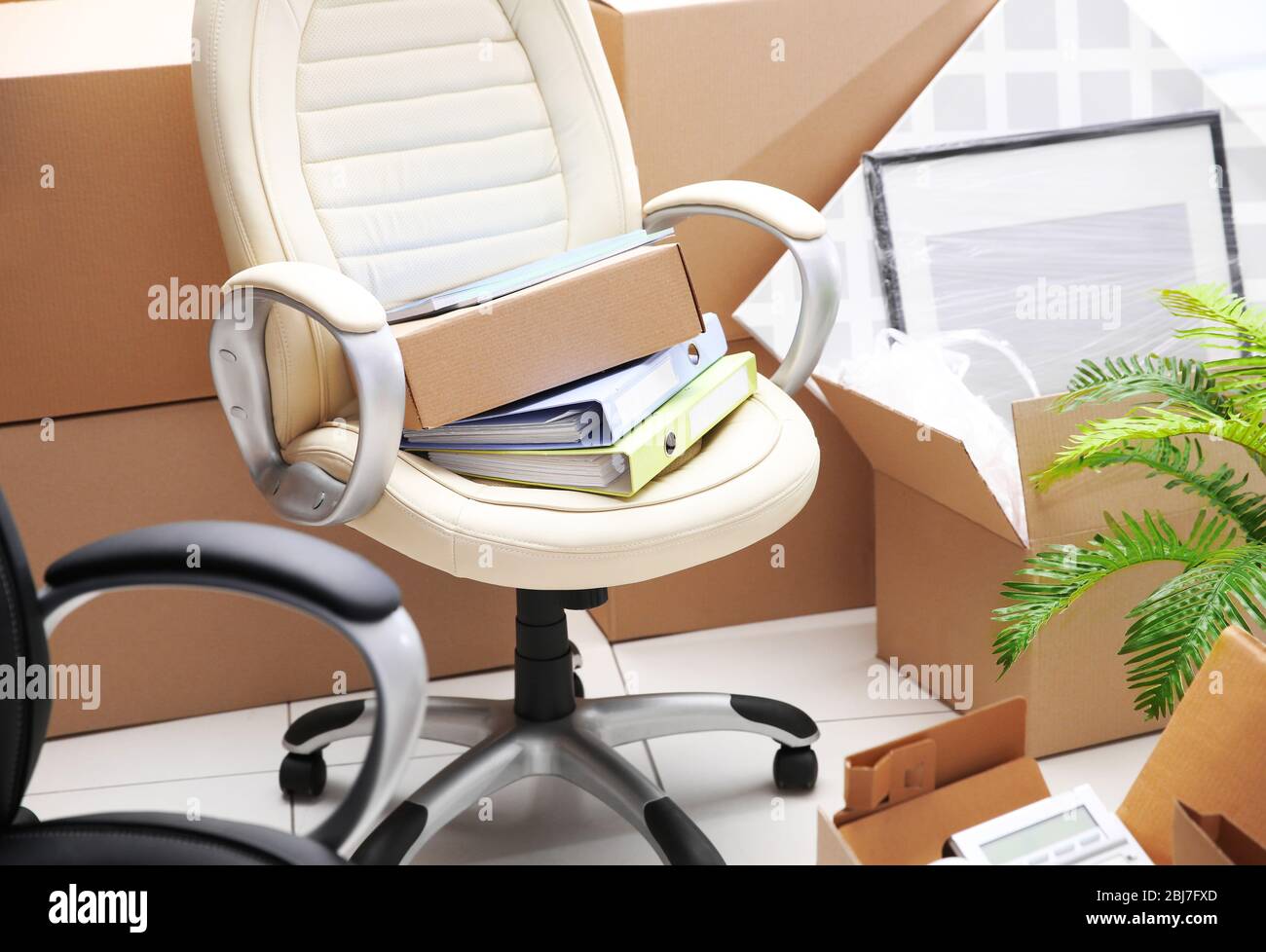 Move concept. Unpacking cardboard boxes in a new office Stock Photo - Alamy