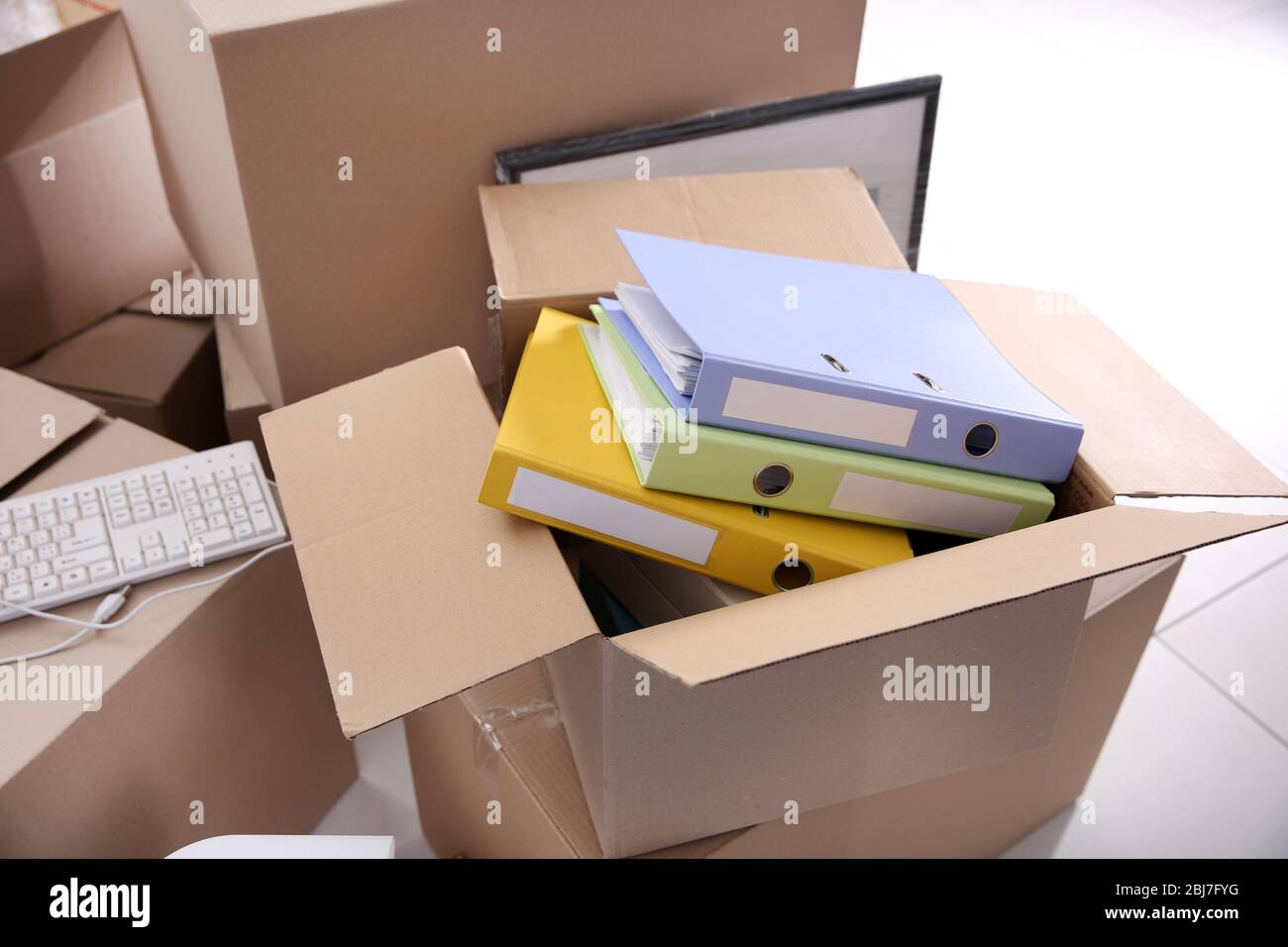 Move concept. Unpacking cardboard boxes in a new office Stock Photo - Alamy