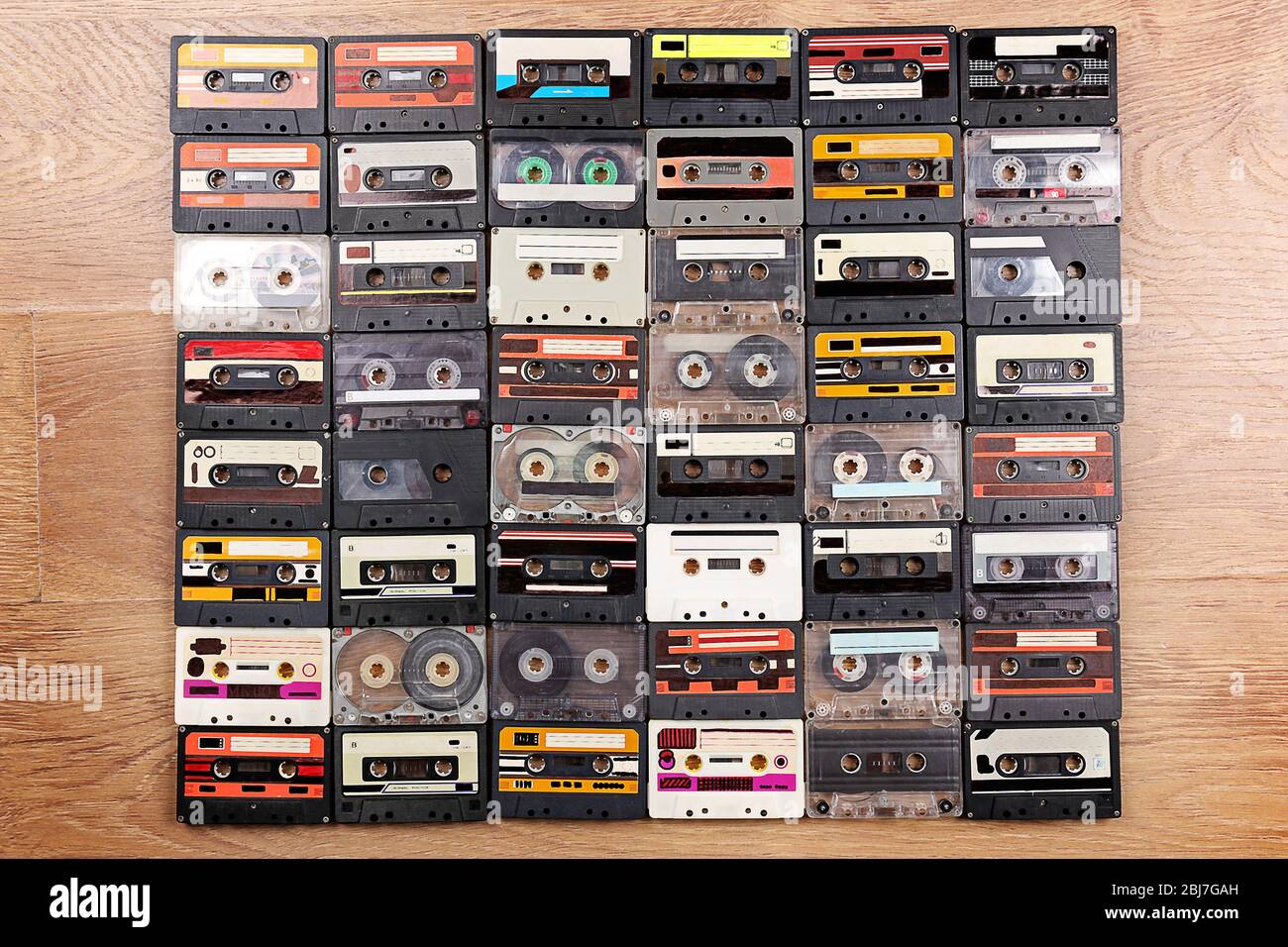Collection of audio cassettes on wooden table background Stock Photo ...