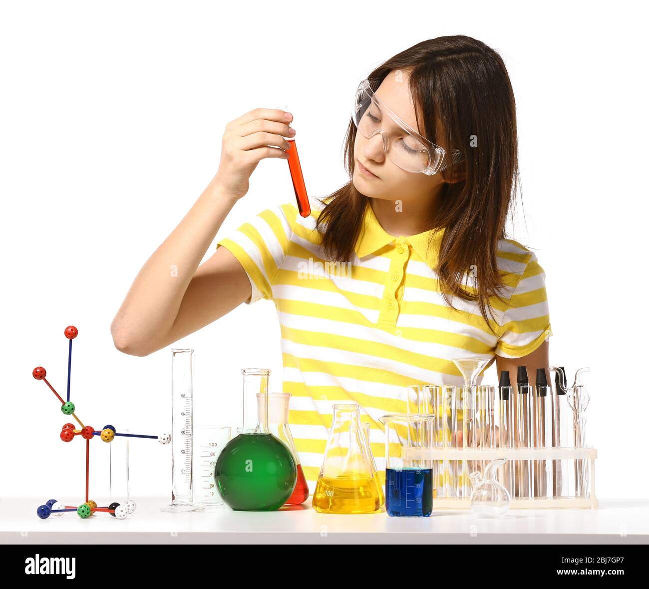 Beautiful girl with chemical flasks and test-tubes isolated on white ...