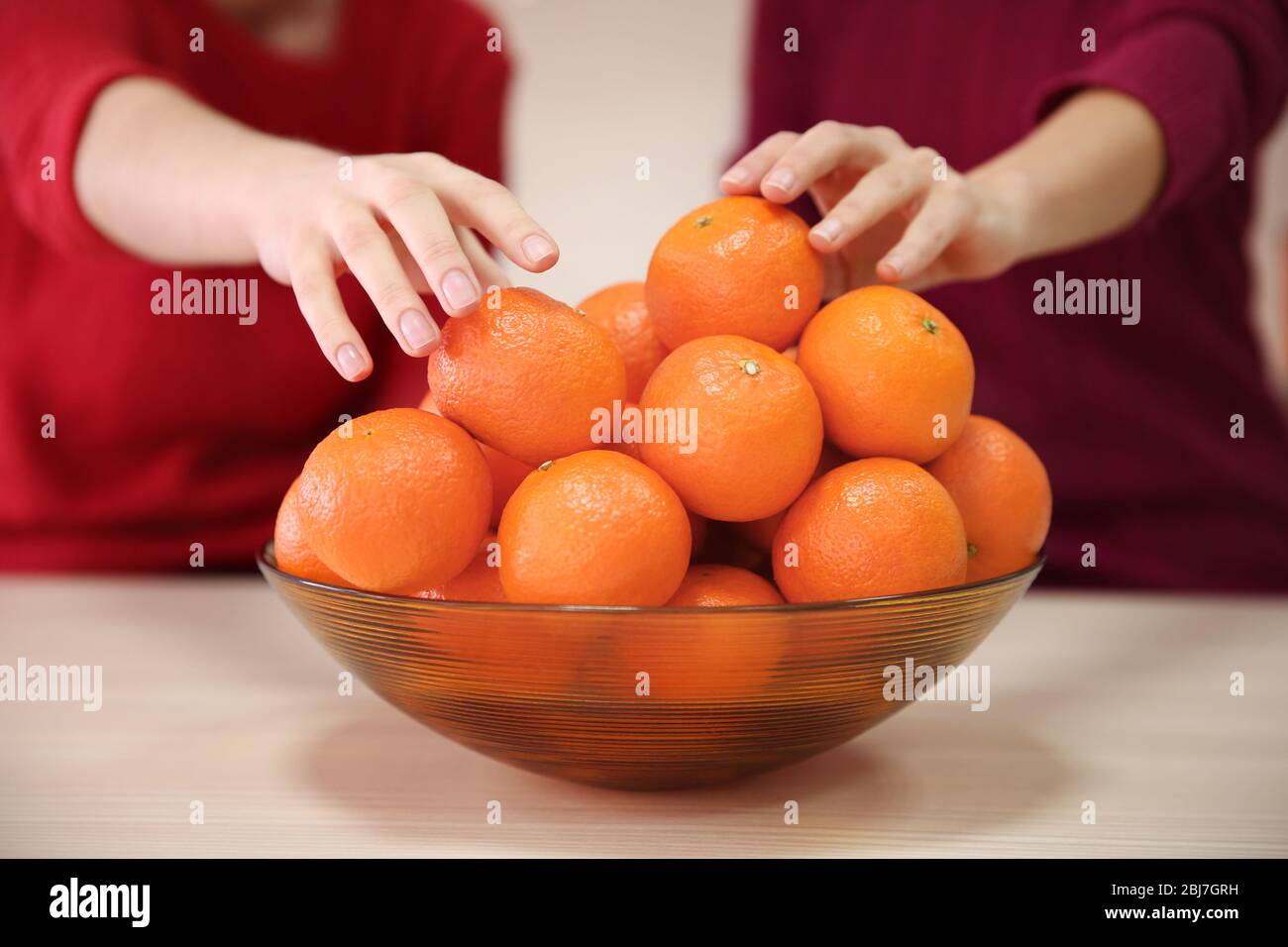 People taking tangerines from hi-res stock photography and images - Alamy