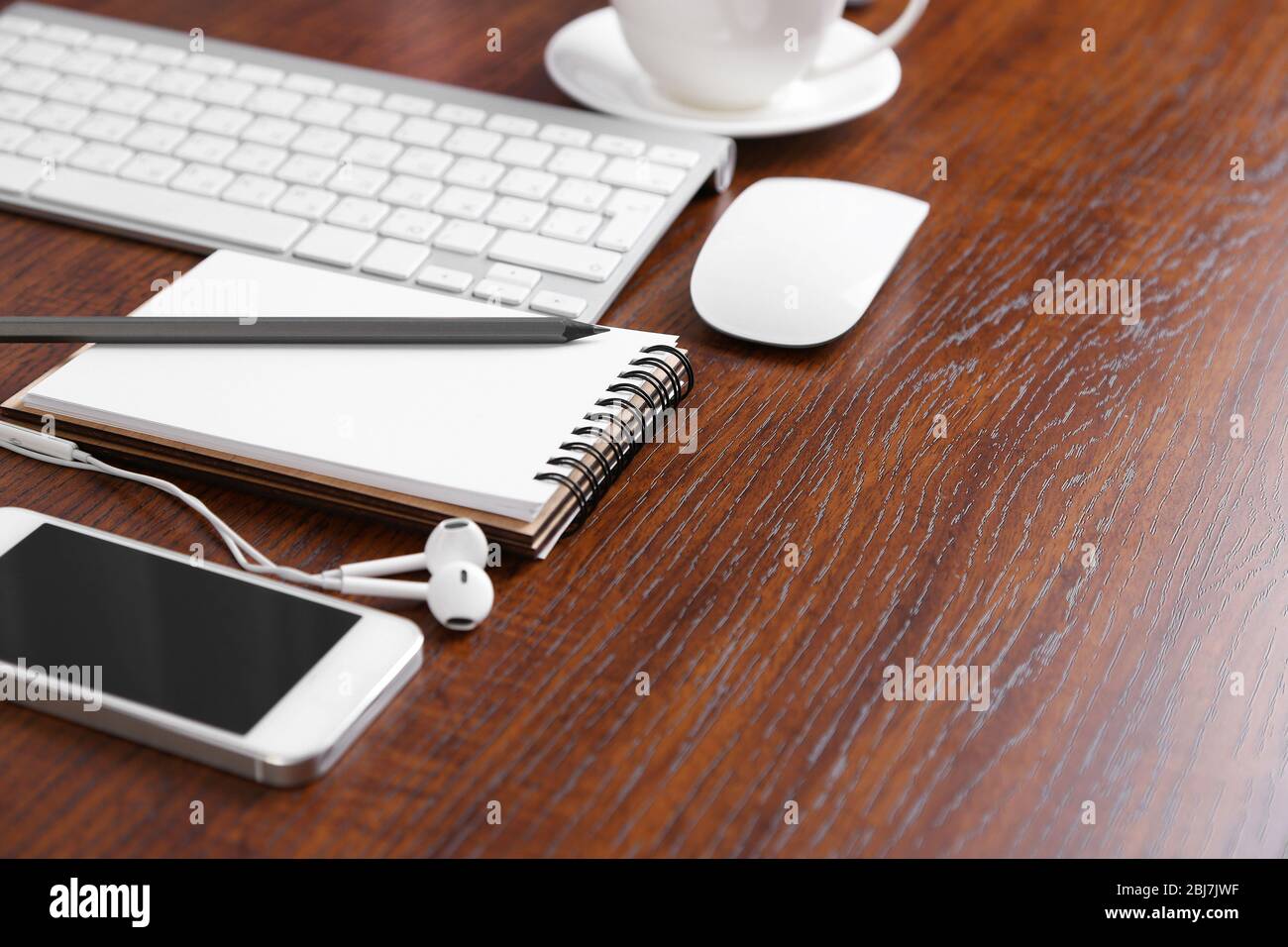 Office table with supplies and gadgets Stock Photo - Alamy