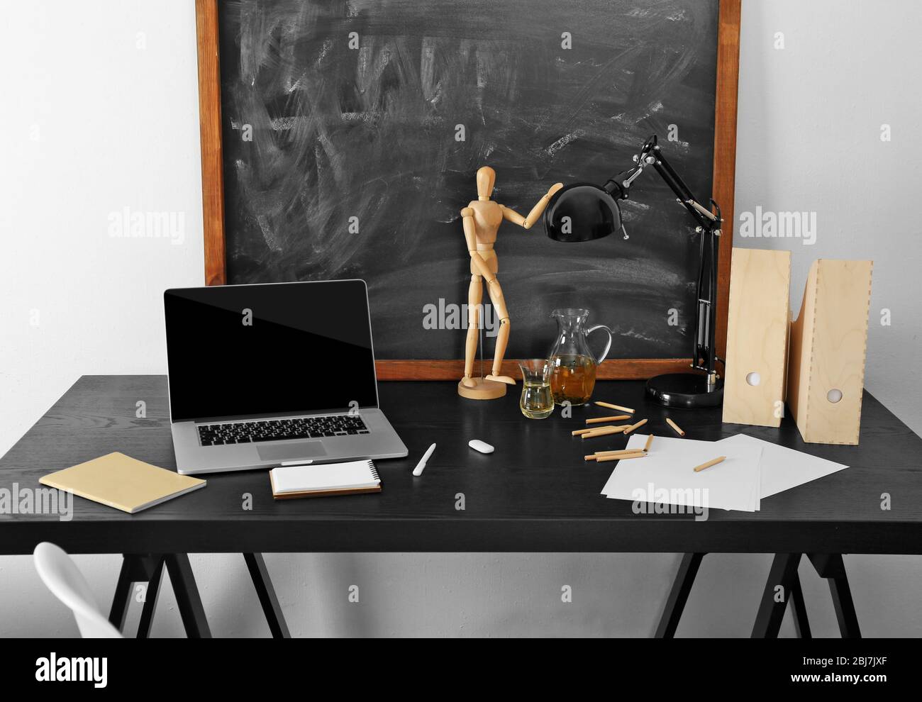 Desktop with notebook and other items on blackboard background Stock ...