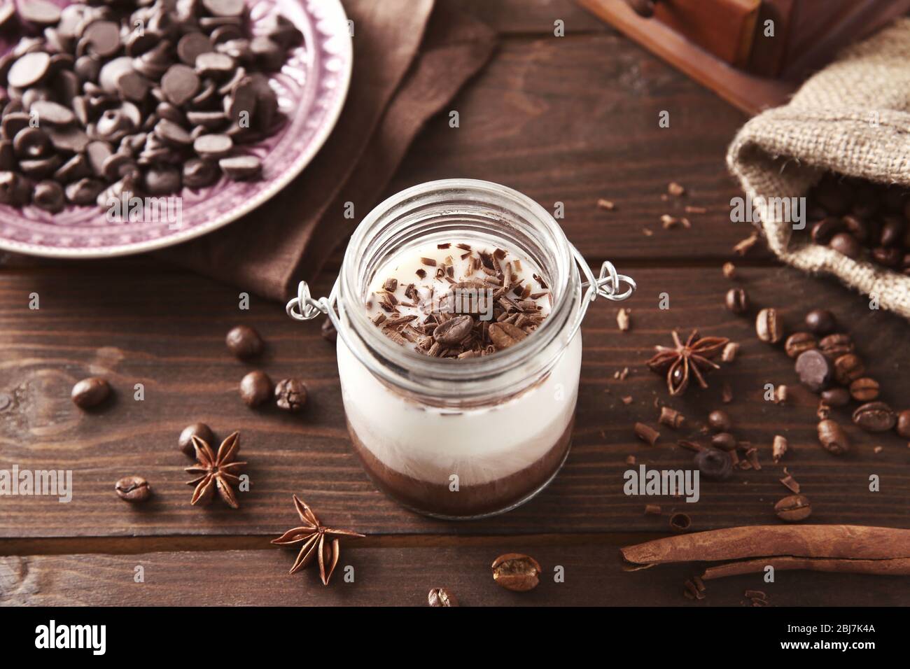 Delicious vanilla-chocolate mousse on wooden background, close up Stock ...