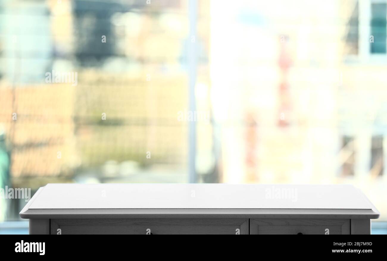 Empty wooden table in the office Stock Photo - Alamy