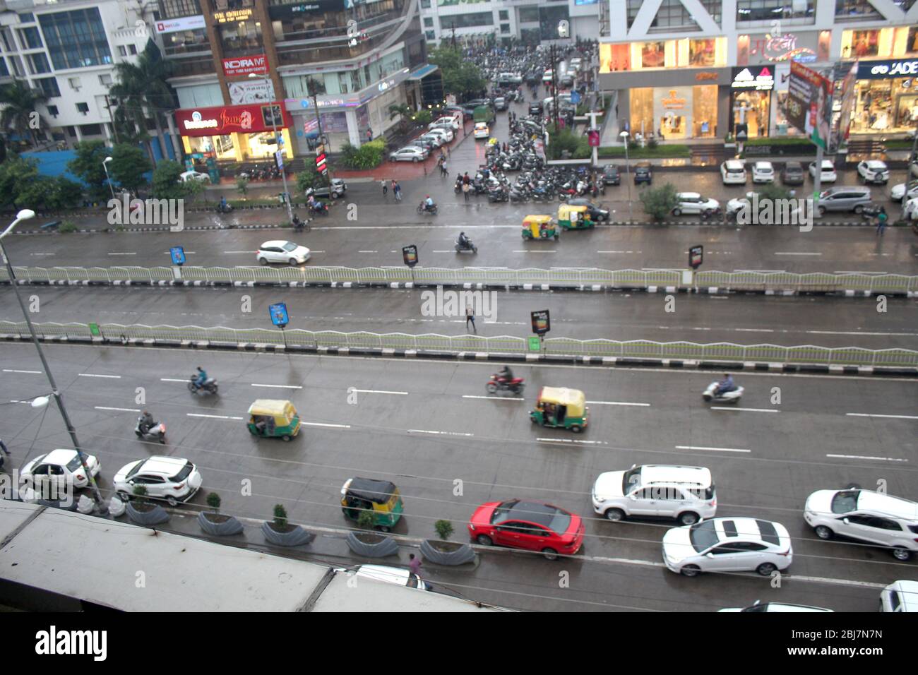 Top view of a developed city road traffic with vehicle, Indian town ...
