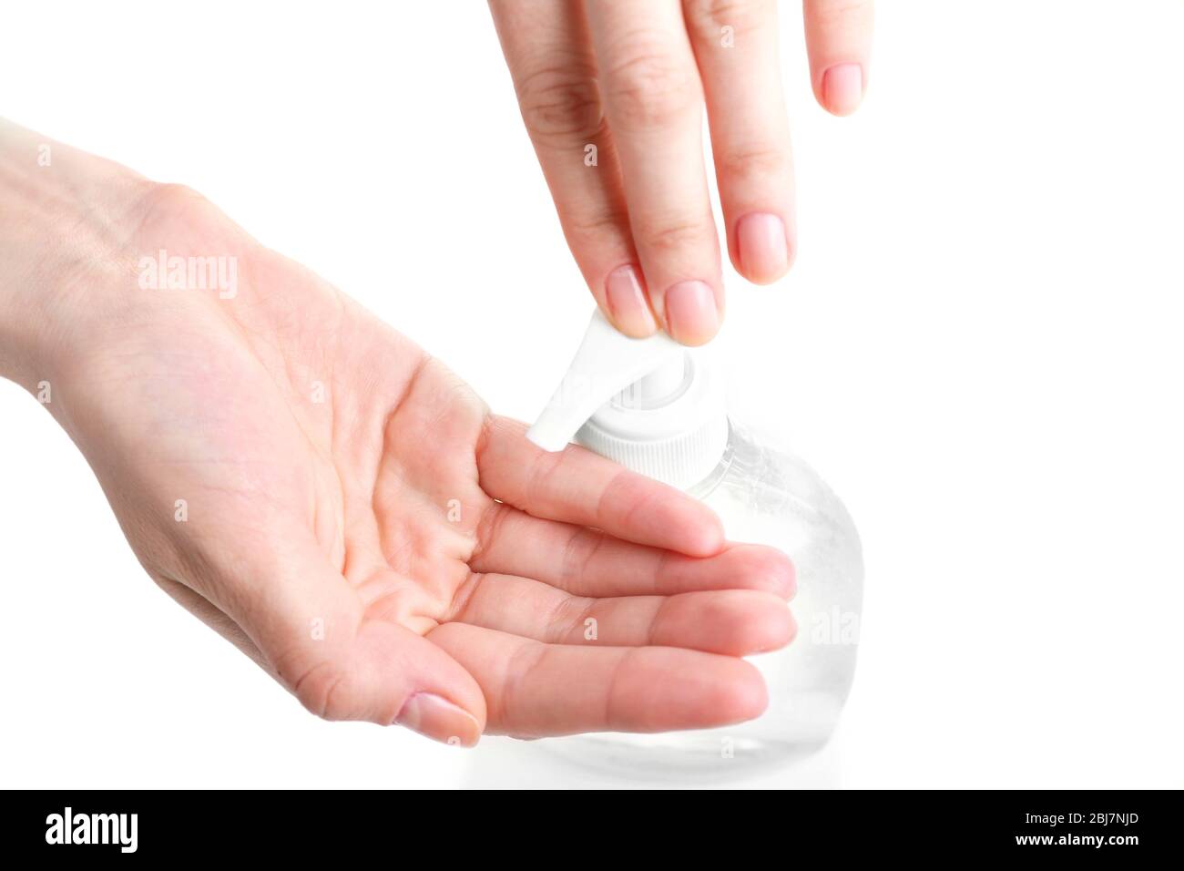 Female hands using liquid soap isolated on white Stock Photo - Alamy