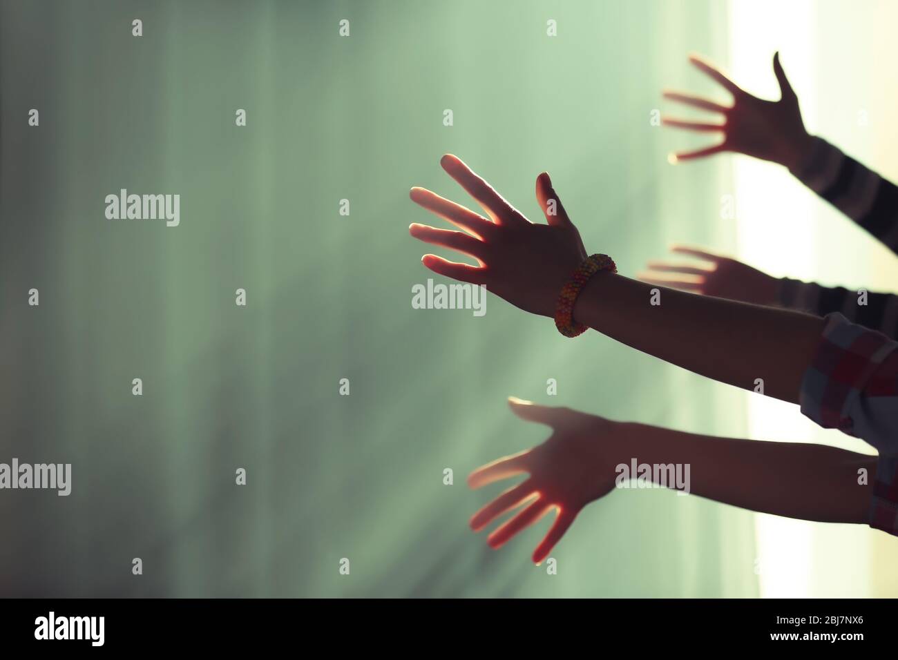 People hands against daylight background Stock Photo - Alamy