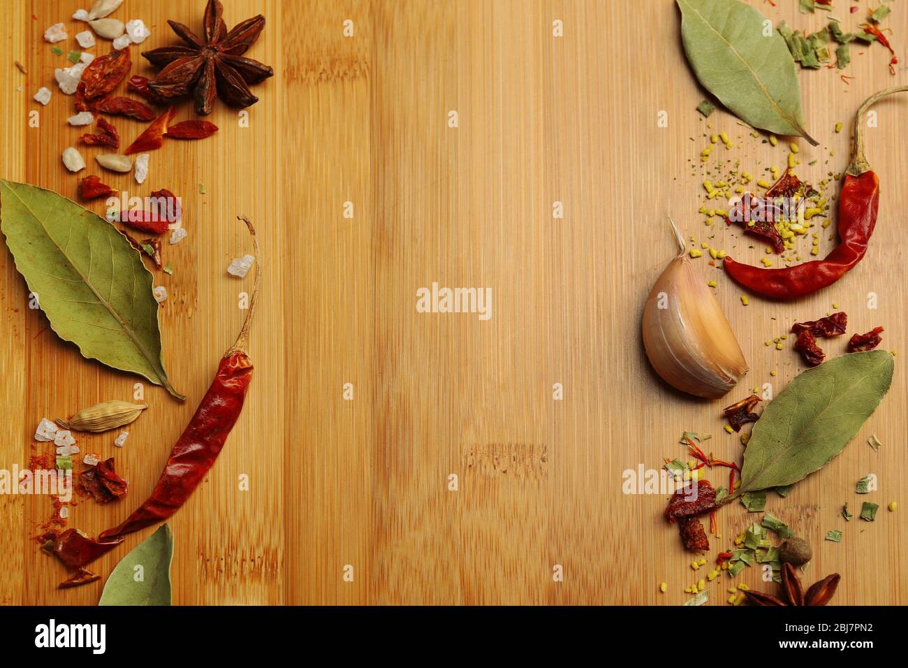 Spices frame on cutting board Stock Photo - Alamy