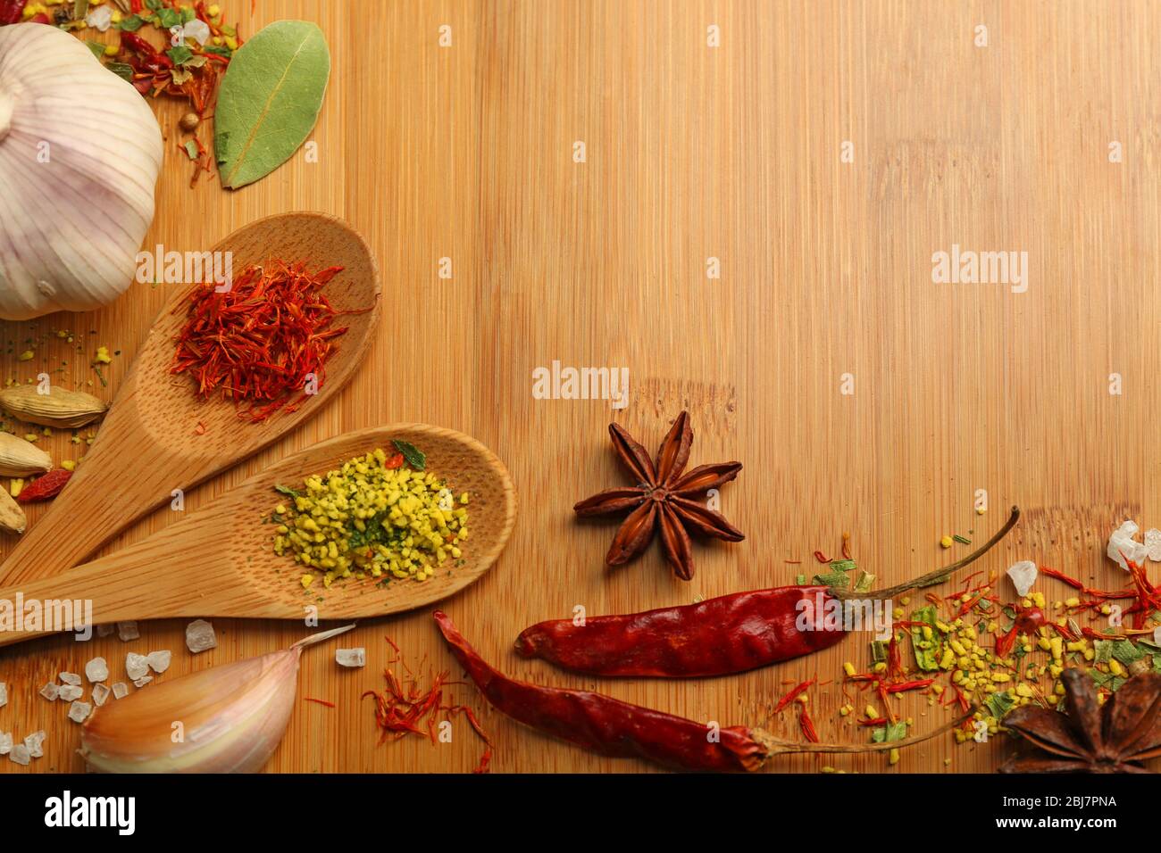 Spices frame on cutting board Stock Photo - Alamy