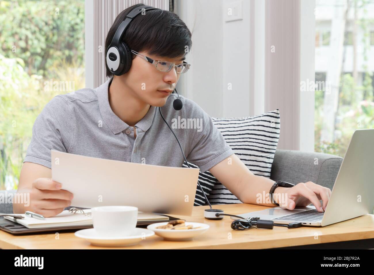 Work from home,Businessman working remotely from home. Using computer ...