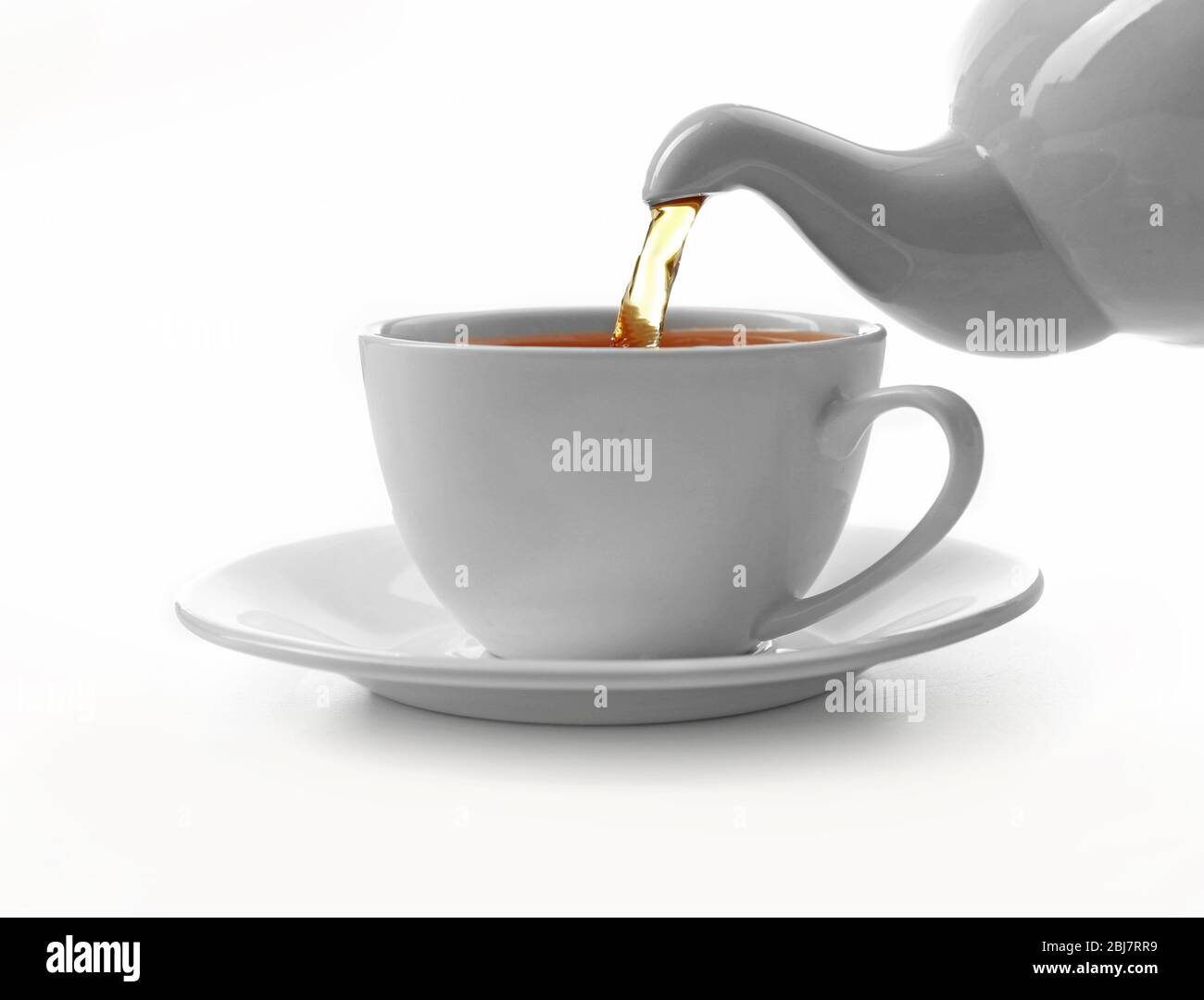 Cup of tea and teapot, isolated on white Stock Photo - Alamy