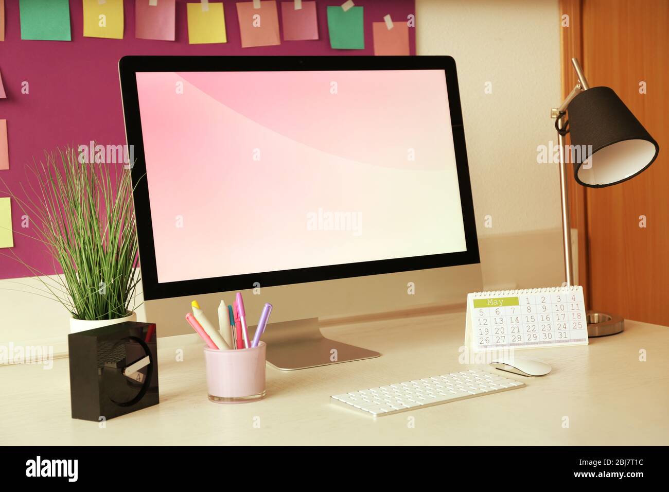 Stylish workplace with computer and interior decorations Stock Photo ...