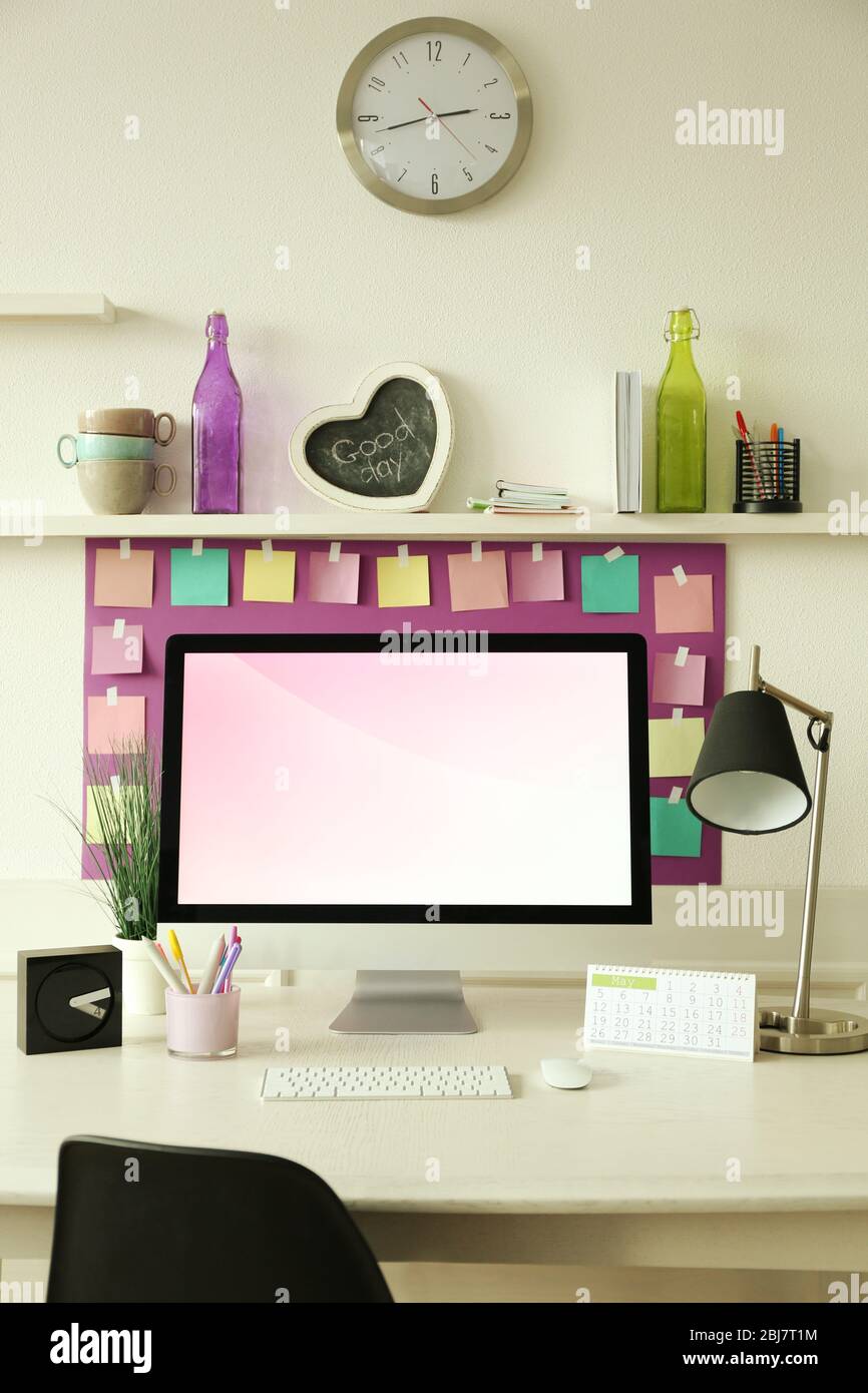 Stylish workplace with computer and interior decorations Stock Photo ...