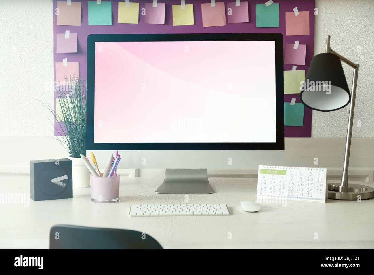 Stylish workplace with computer and interior decorations Stock Photo ...