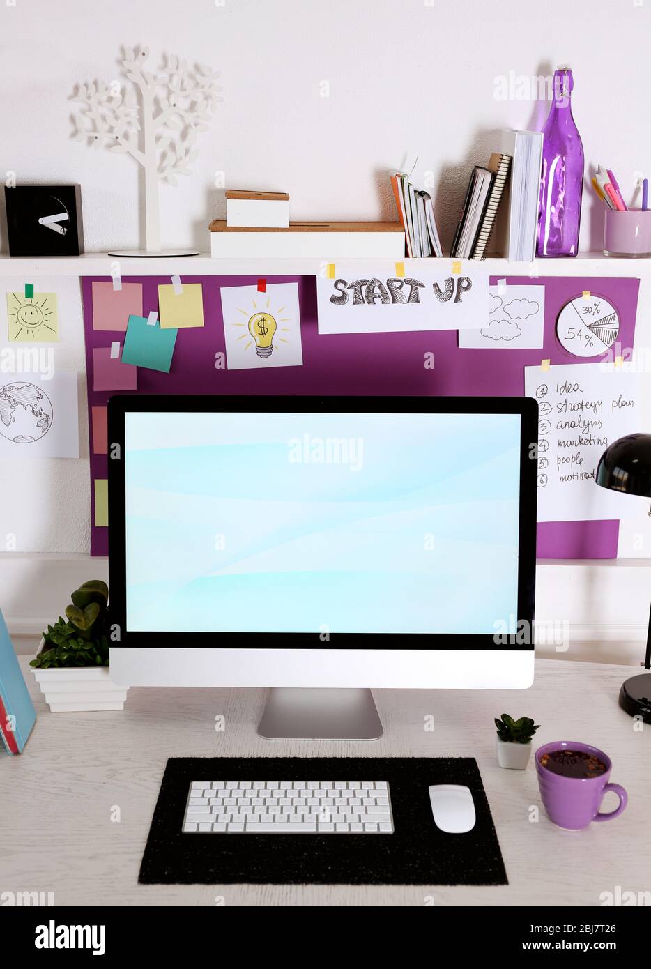 Stylish workplace with computer and interior decorations Stock Photo ...