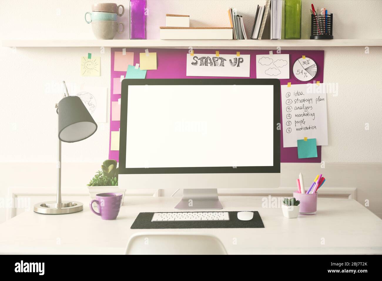 Stylish workplace with computer and interior decorations Stock Photo ...