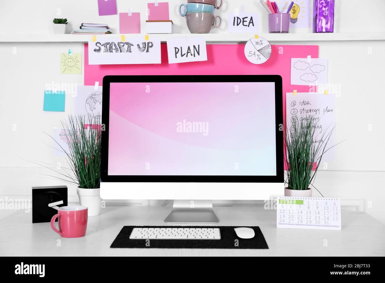 Stylish workplace with computer and interior decorations Stock Photo ...