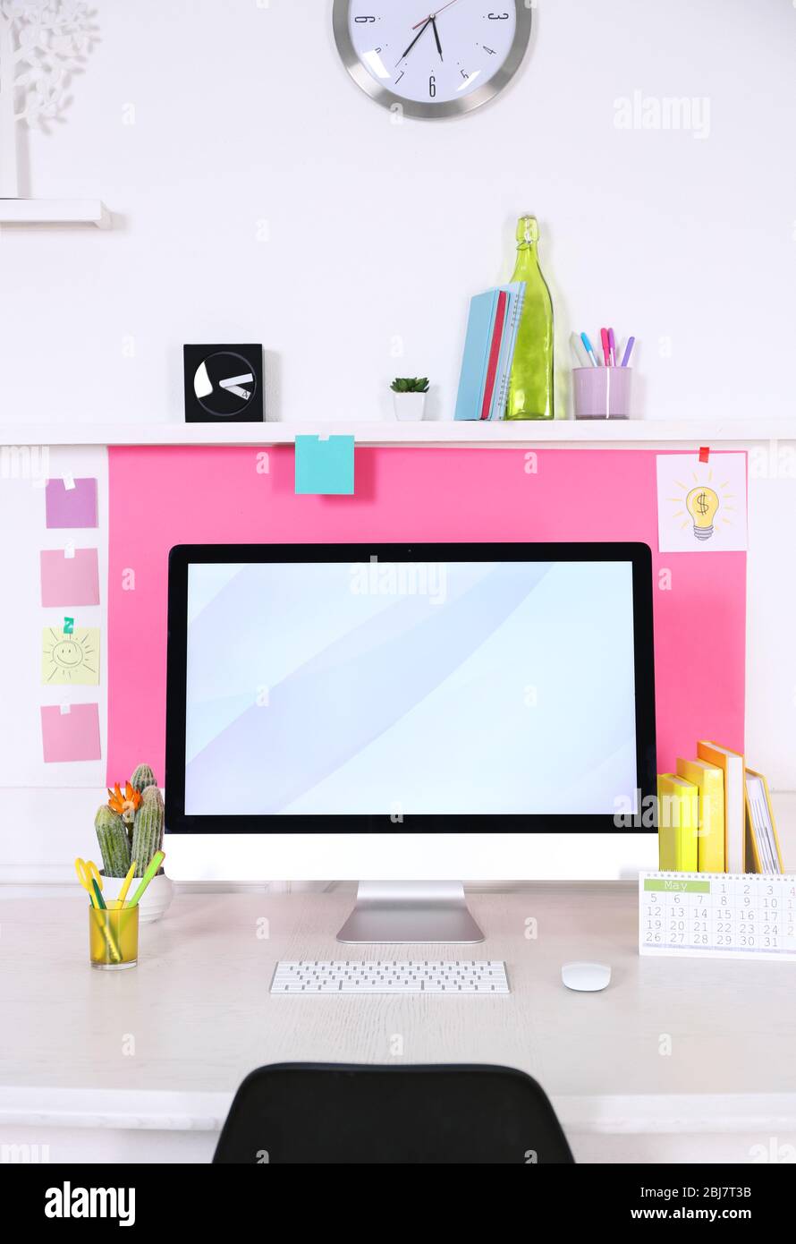 Stylish workplace with computer and interior decorations Stock Photo ...