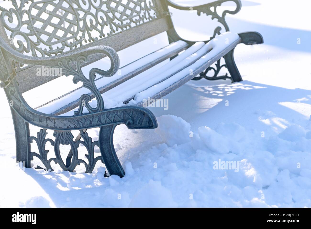 Snowy bench in the park Stock Photo - Alamy