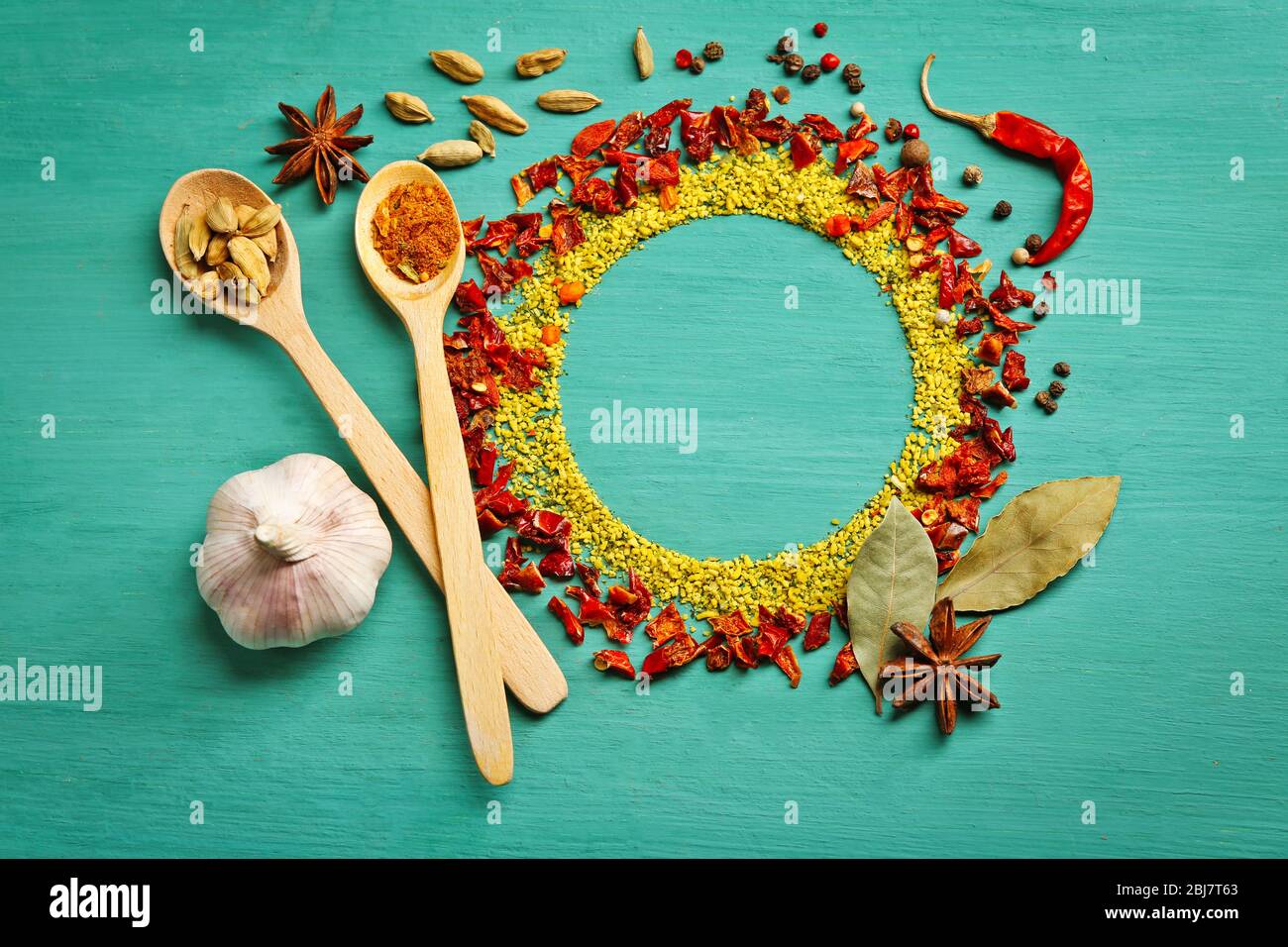 Ring of various spices on wooden background Stock Photo - Alamy