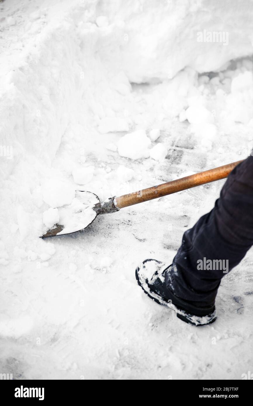 Clearing snow garden with shovel hi-res stock photography and images ...