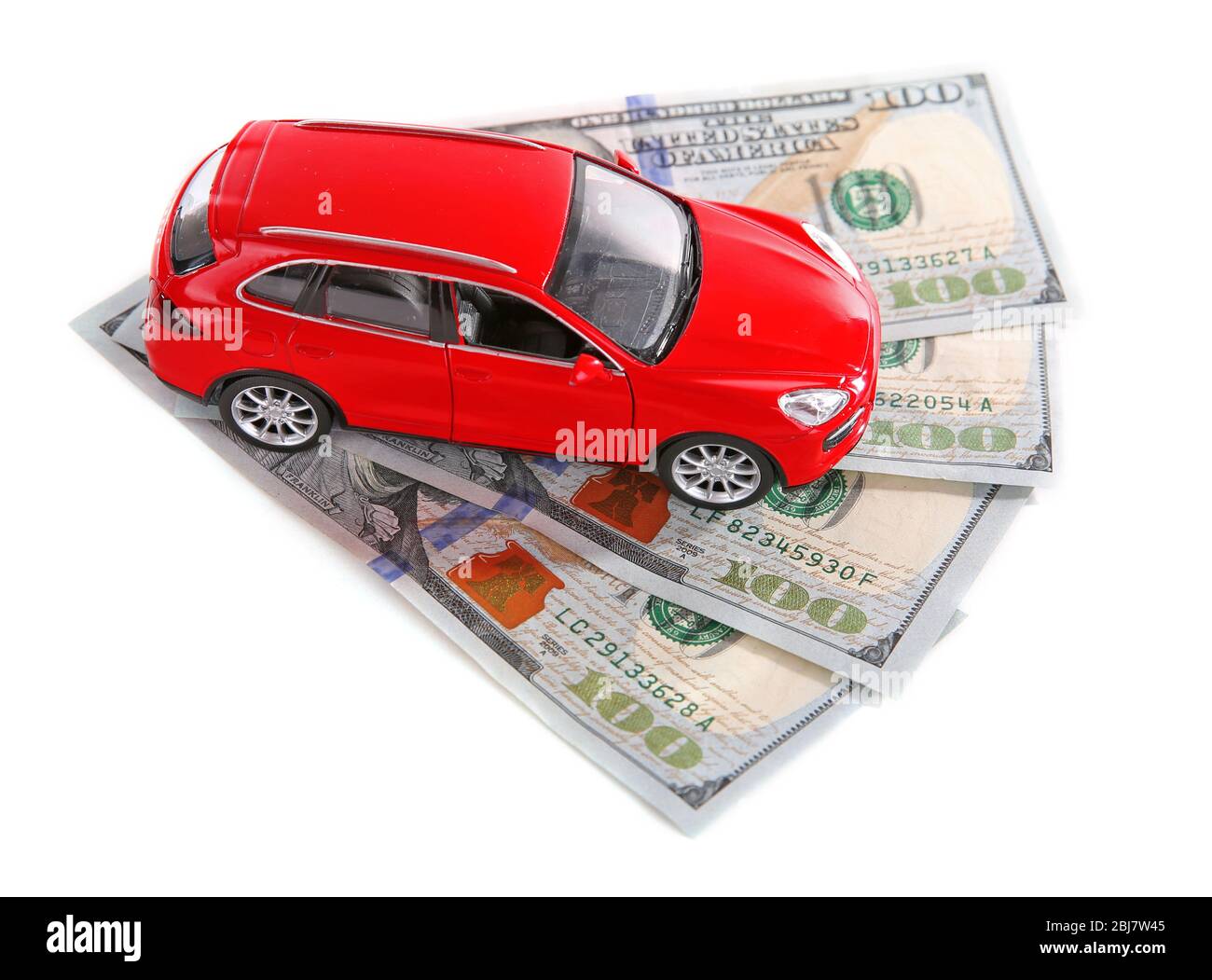 Red car with money, isolated on white Stock Photo - Alamy